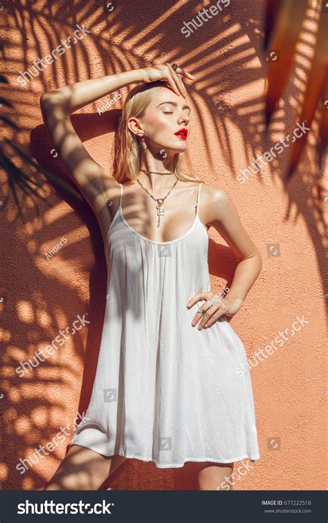 4 Portrait Of A Beautiful Young Woman With Long Blonde Hair Green