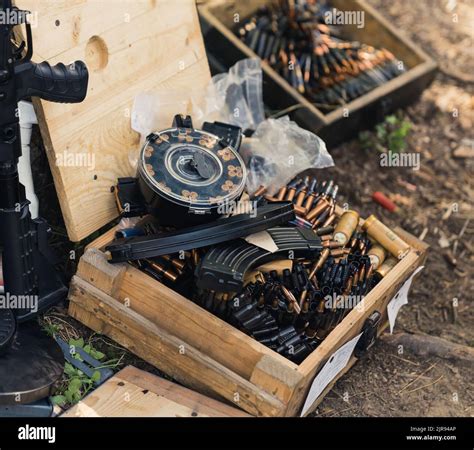 Square Outdoor Shot Of Two Wooden Boxes Filled With Ammunition And