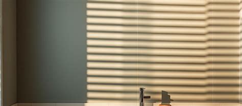 Premium Photo Bathroom With Faint Light And Blinds Projecting Shadows
