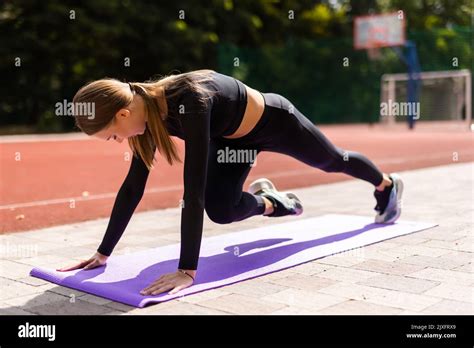 Fitness Girl Doing Abs Exercise To Tone Stomach Muscles Tiger Curl