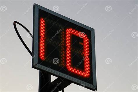 Traffic Light Counter Showing The Number Ten 10 Against A Clear Blue Sky Stock Image Image