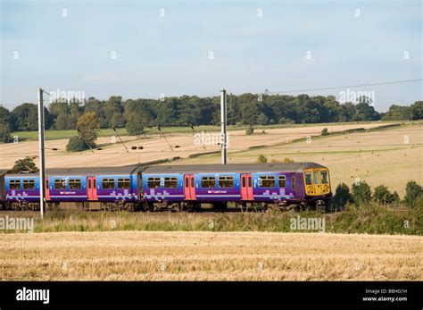 Passenger Train Class 319 In First Capital Connect Livery Speeding