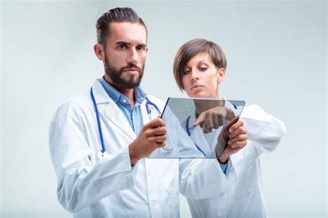 Professionals Consult AI Driven Tablet For Insights Stock Image Image