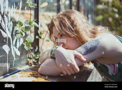 Close Up Thoughtful Woman Resting On Crossed Arms Portrait Picture