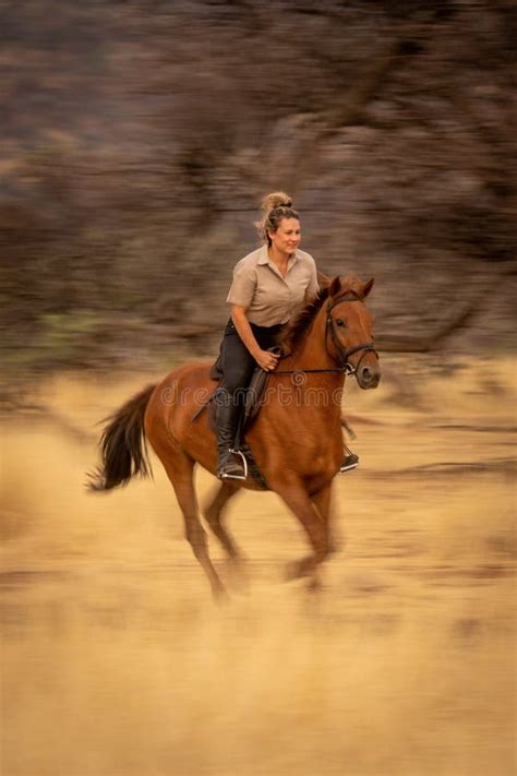 Slow Pan Of Blonde Riding Near Trees Stock Image Image Of Person