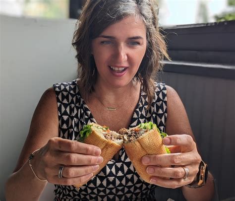 Premium Photo A Woman Admiring Her Delicious Looking Sandwich