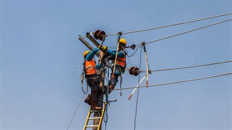 The Work Of Connecting Electrical Cables Was Carried Out By Two Experts Stock Image Image Of