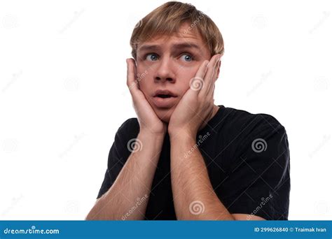 Handsome Caucasian Blond Teenager Guy In A Black T Shirt Is Worried And