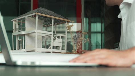 Skilled Engineer Compare House Design Between Model And Blueprint