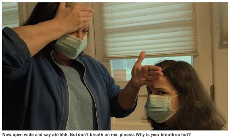 COVID Temperature Check Just Mom Feeling Forehead With Back Of Hand The Brown Noser