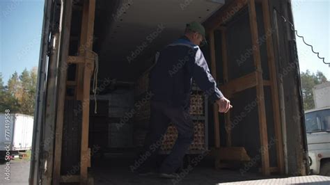 Factory Worker Unloading The Huge Truck Worker Unloading The Heavy Rack Full Of Chicken Egg