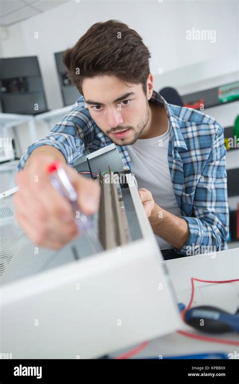 Man Fixing A Radiator Stock Photo Alamy