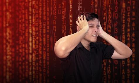 Premium Photo Young Asian Man Stressed Out Because Of Information Overload Red Binary Code On