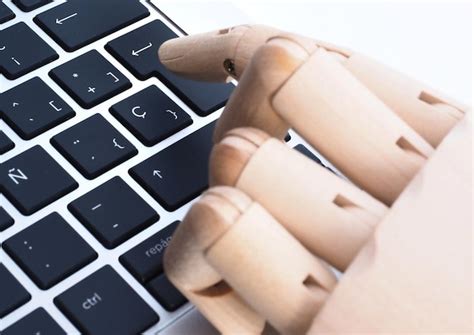 Premium Photo Wooden Hand Pressing Enter Key On Computer Keyboard