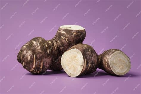 Premium Photo Close Up Of Three Cut Up Gingers On Purple Background