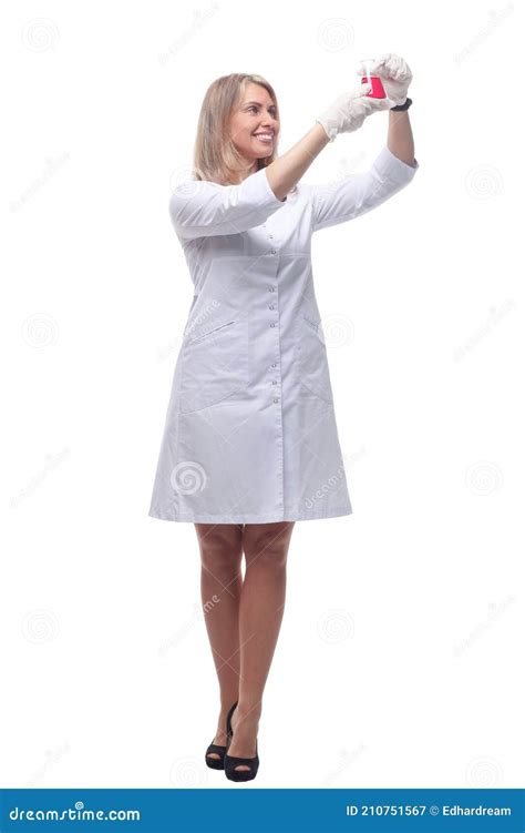 Female Laboratory Assistant Looking At The Liquid In A Laboratory Bottle Stock Image Image