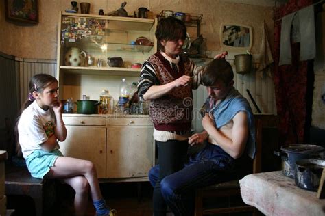 Mother Cuts Hair Son In Kitchen Of Rural House Russia Editorial Stock