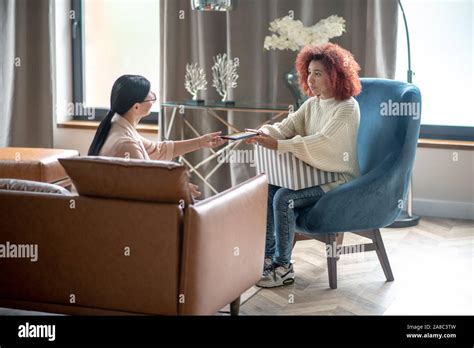 Woman Showing Photo Of Her Son After She Lost Him In Car Accident Stock Photo Alamy