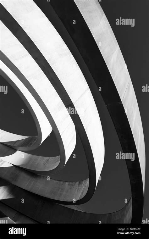 Striking Monochrome Architectural Feature With Sweeping Curves And A Dynamic Interplay Of Light