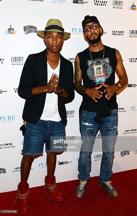 Pharrell Williams And Swizz Beatz Arrive At Pure Nightclub On August