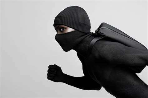 Stealthy Thief In Black Attire Premium Ai Generated Image