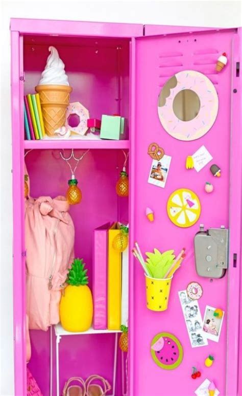A Pink Locker Filled With Lots Of Items And Decor On Top Of A White Wall