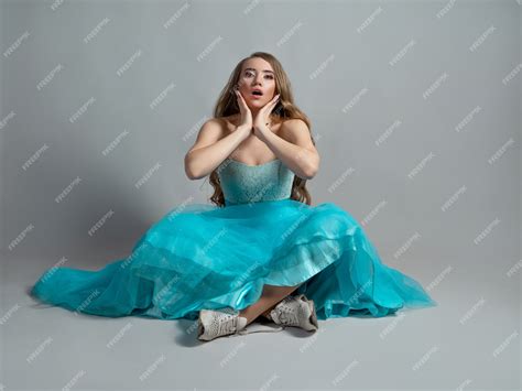 Premium Photo Beauty In Shock A Young Beautiful Blonde In A Lush Blue