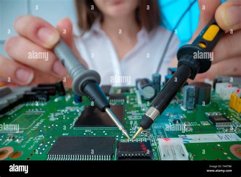 Girl With Measuring Devices In The Electronics Laboratory Stock Photo Alamy