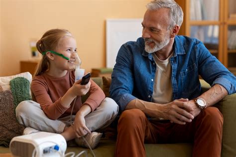 Premium Photo Front View Man And Girl With Nebulizer