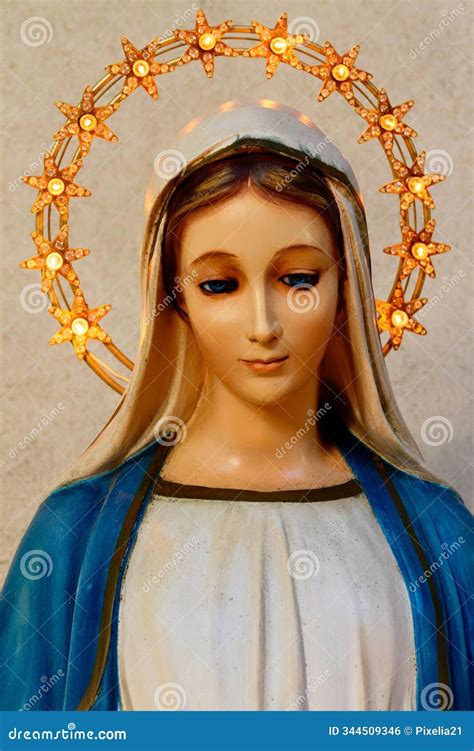 Statue Of A Young Blessed Virgin Mary With Lights And Stars Editorial