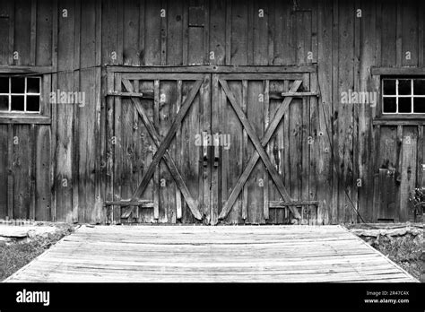 A Classic Vintage Style Barn With Two Large Doors And Rectangular