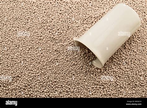 Porcelain Laboratory Beaker On Composite Mineral Fertilizers Stock
