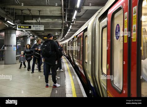 Passengers Seen Waiting On Westminster Underground Station Platform As