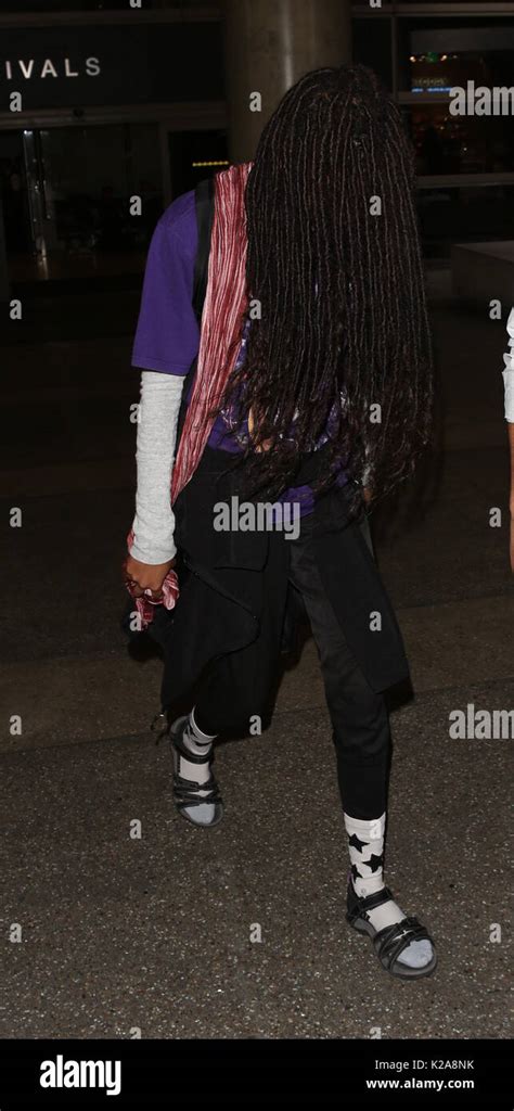 Willow Smith Hides Her Face With Her Long Dreadlocks At Los Angeles International Airport