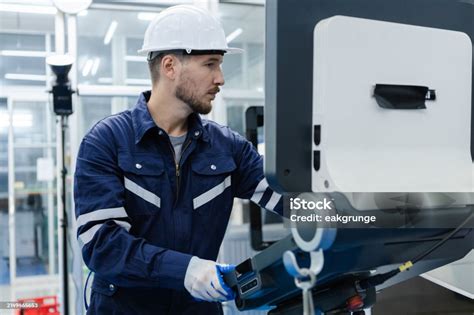 Man Engineer Using Computer Controlling Cnc Machine At Workshop Professional Male Control