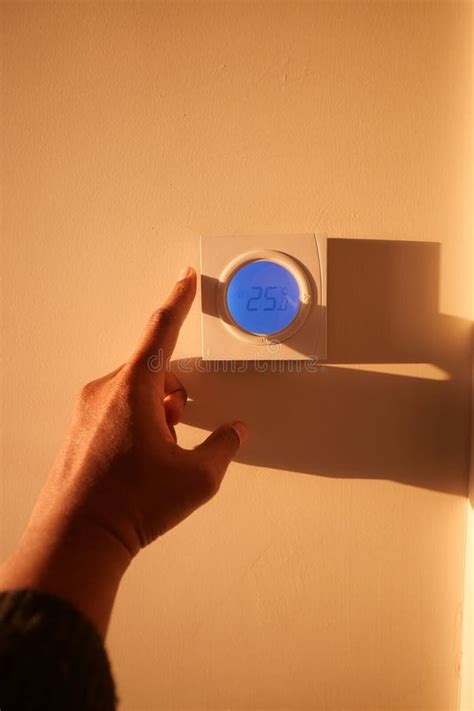 Adjusting A Modern Thermostat To Set The Temperature Comfortably Stock Image Image Of