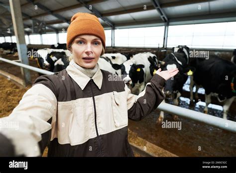 Young Confident Farmer In Workwear Looking At Camera While Making
