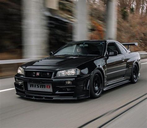 Gorgeous Black Nissan Skyline R34 Gt R Running On Road Carporn In