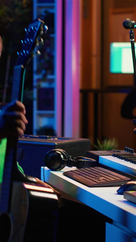 Vertical Musical Producer Prepares To Record Tunes On Acoustic Instrument Working In Personal