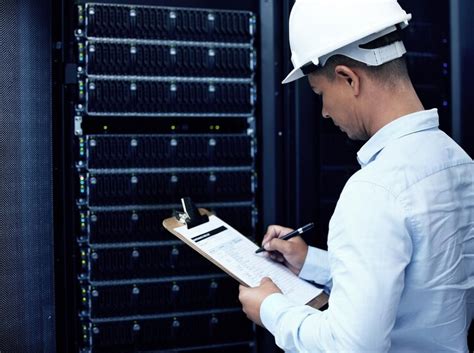 Premium Photo Computer Center Man And Data Engineer With Checklist Back And Safety As