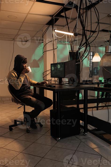 Young Man Working On Security Breach Hacking Committing Cyberterrorism And Stealing Personal