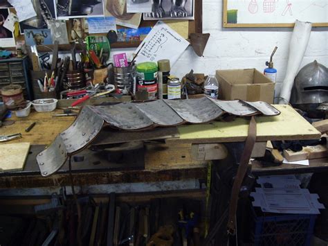 Table With Rivet Heading Tool In Use