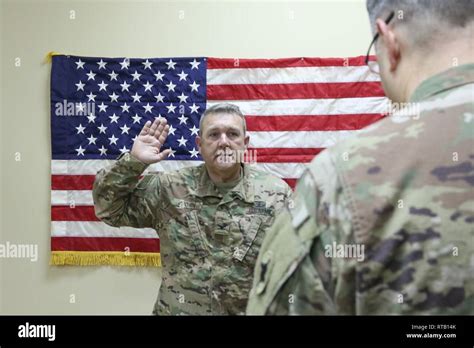 Col Jonathan Brown Recites The Officers Oath Of Office Given By Brig