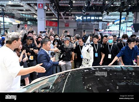 He Xiaopeng The Chairman Of Xpeng Motors Interacted With The Robot Iron At The 2025 Shanghai