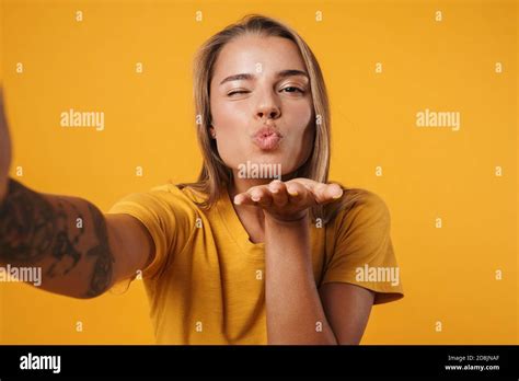 Image Of Young Joyful Woman Blowing Air Kiss And Taking Selfie Photo