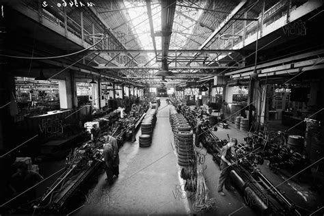 Workers In The Peugeot 203 Chassis Assembly Workshop On