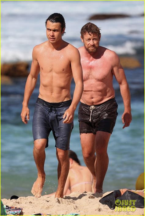 Simon Baker Goes Shirtless During Beach Day With 22 Year Old Son Claude See Photos Photo