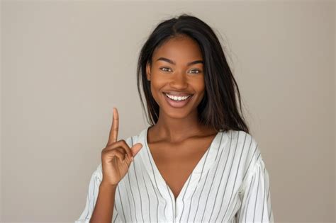 A Woman Smiling And Pointing To The Side With Her Right Hand Premium Ai Generated Image