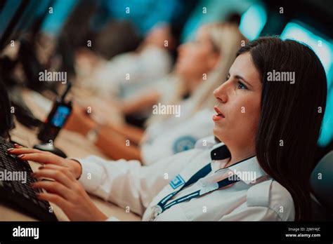 Female Security Operator Working In A Data System Control Room Offices Technical Operator