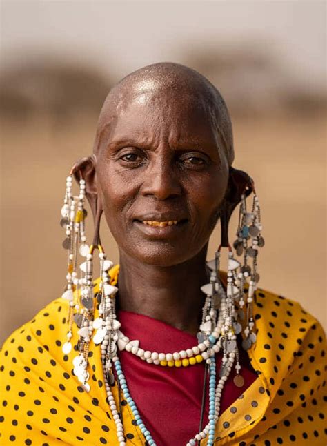 Download Native Woman Dressed In Traditional Attire Wallpaper